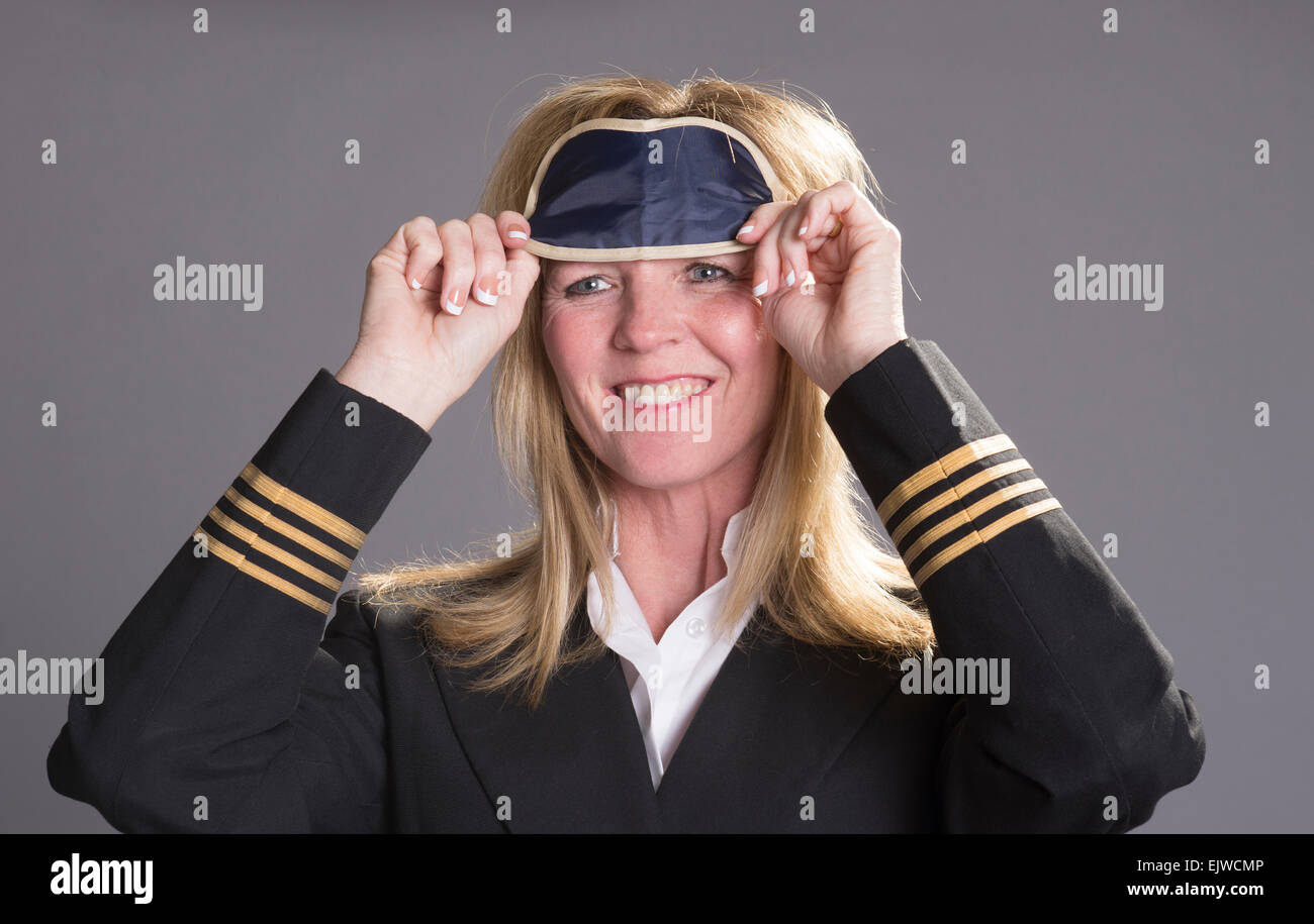 Sleepy aircrew officer using an eye shade Stock Photo - Alamy