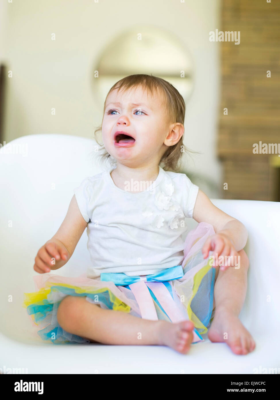 Baby girl (12-17 months) crying Stock Photo - Alamy
