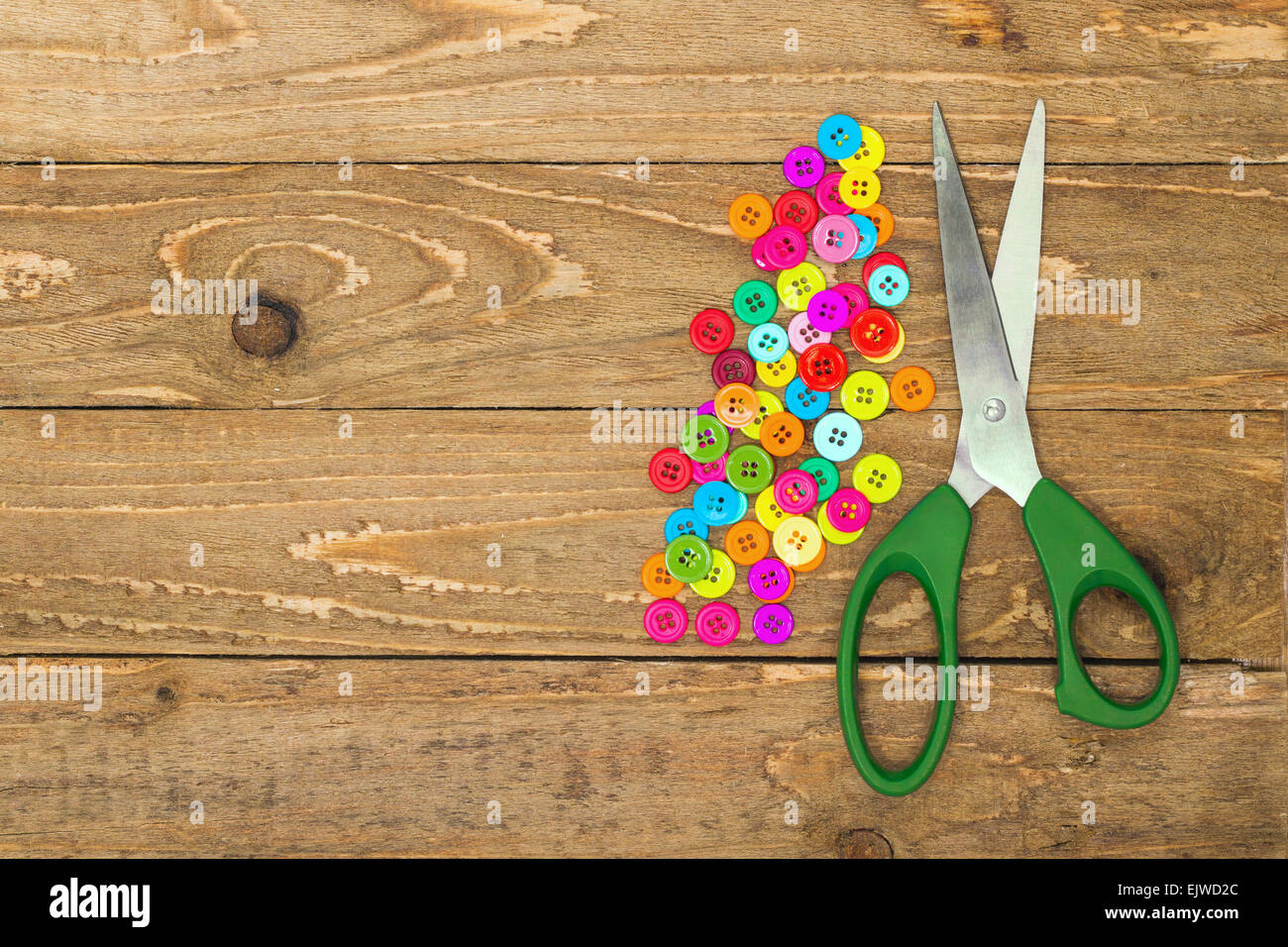 Colorful buttons and scissors Stock Photo - Alamy