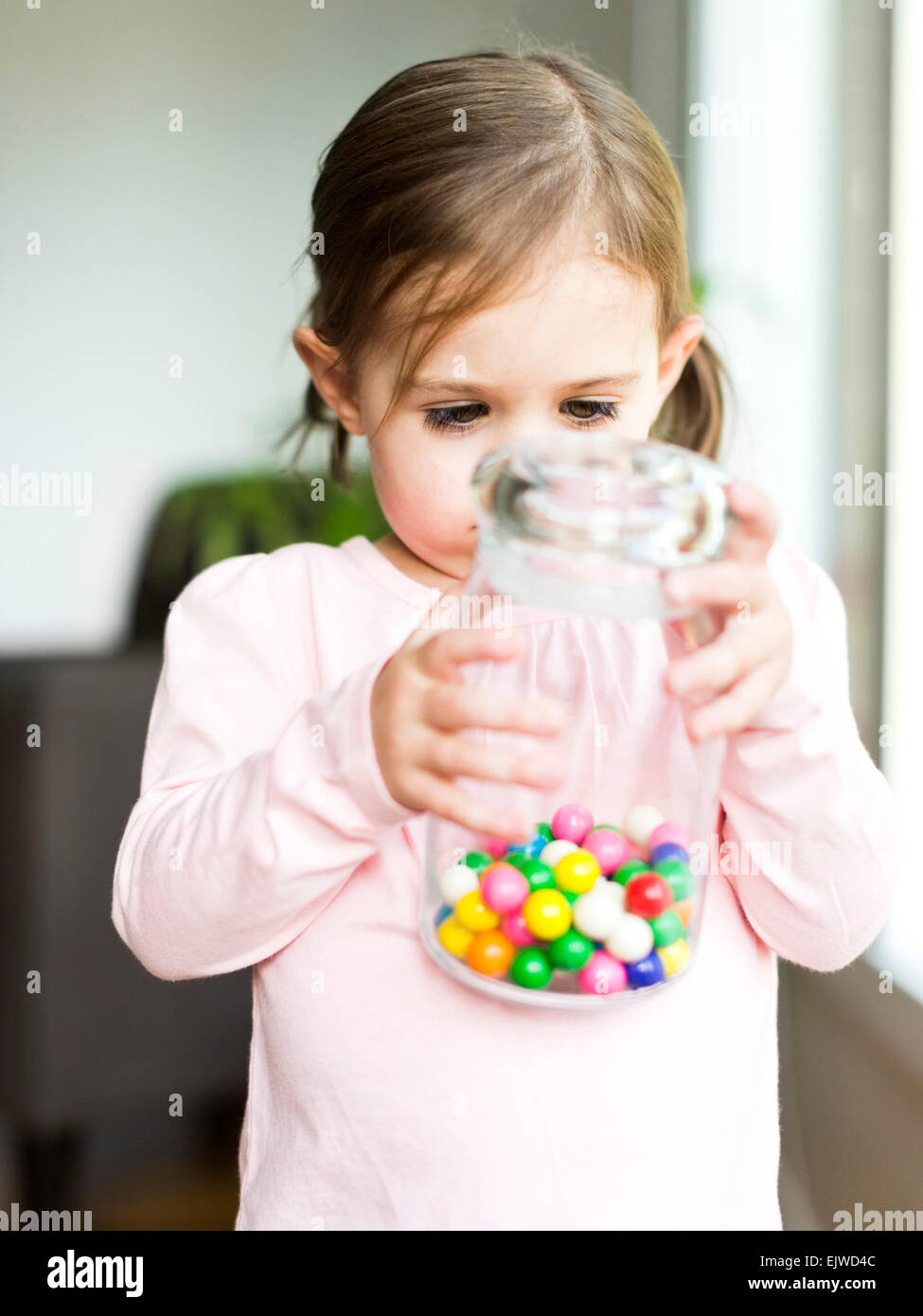 Girl holding glass jar hi-res stock photography and images - Alamy