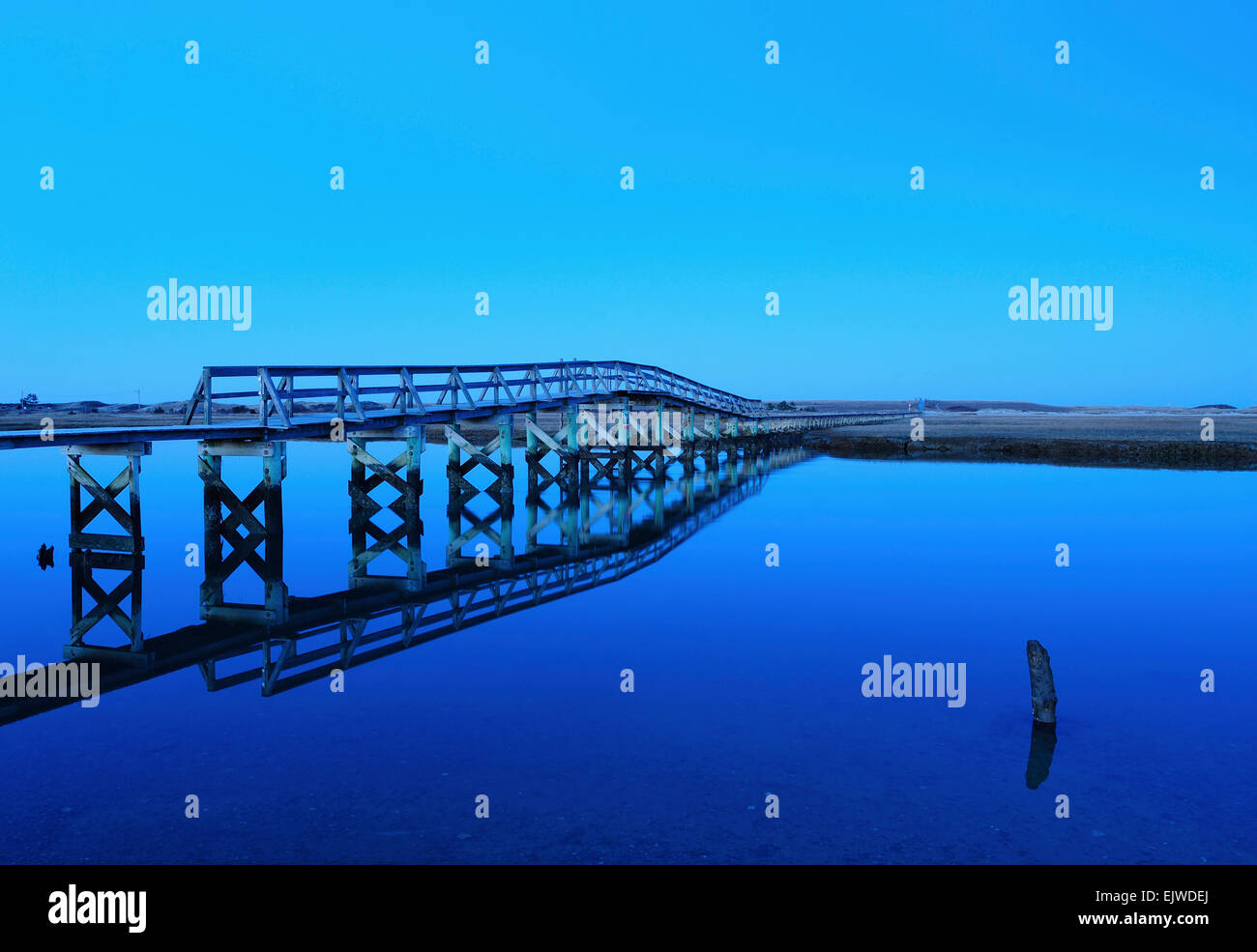 USA, Massachusetts, Cape Cod, Sandwich, Bridge reflecting in water ...