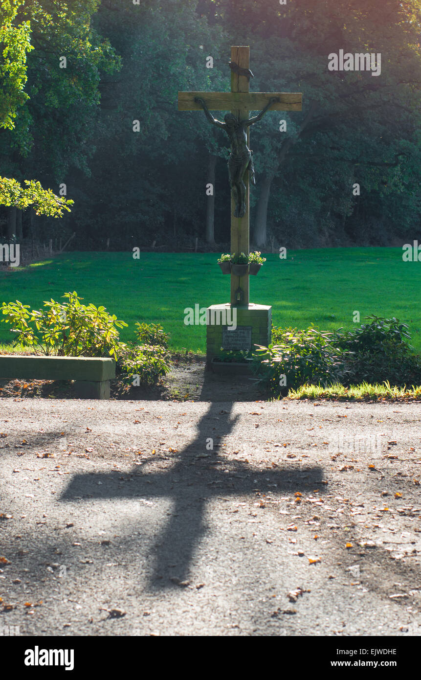 silhouette of a jesus cross in a rural landscape Stock Photo - Alamy
