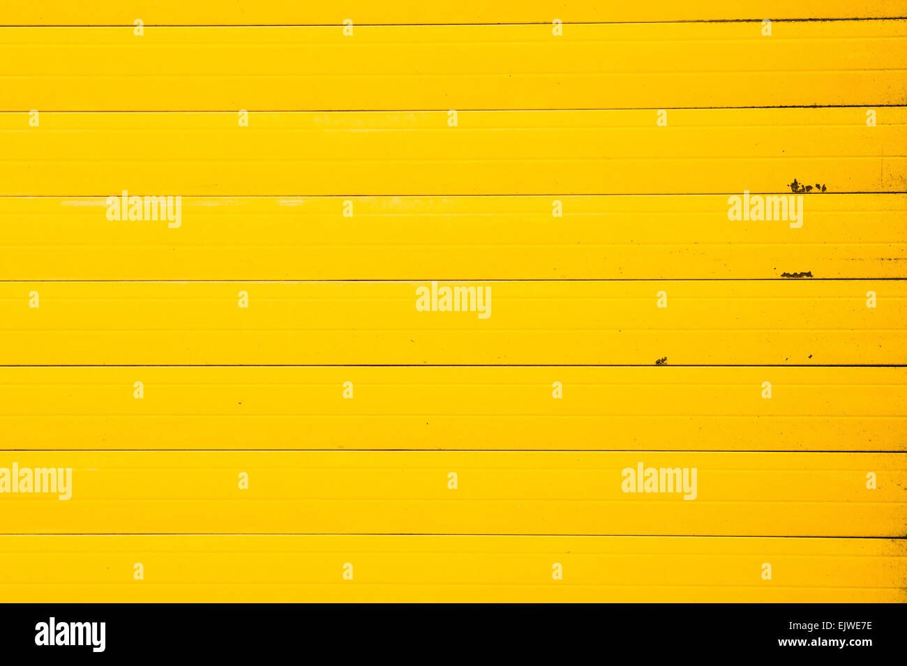 Part of a yellow metal sheet as a background image Stock Photo - Alamy