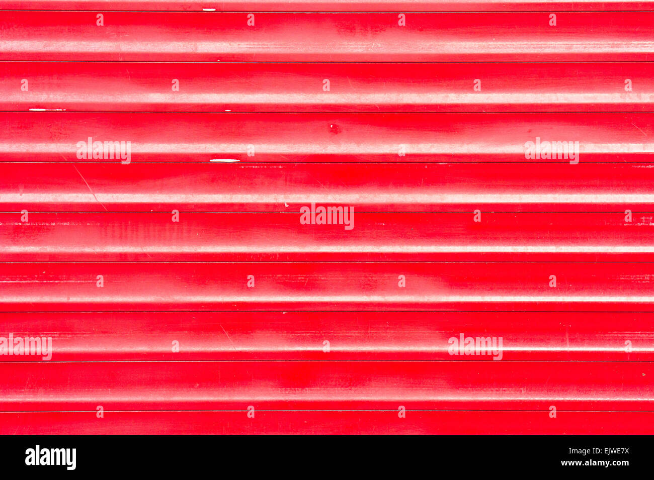 Part of a red metal sheet as a background image Stock Photo - Alamy