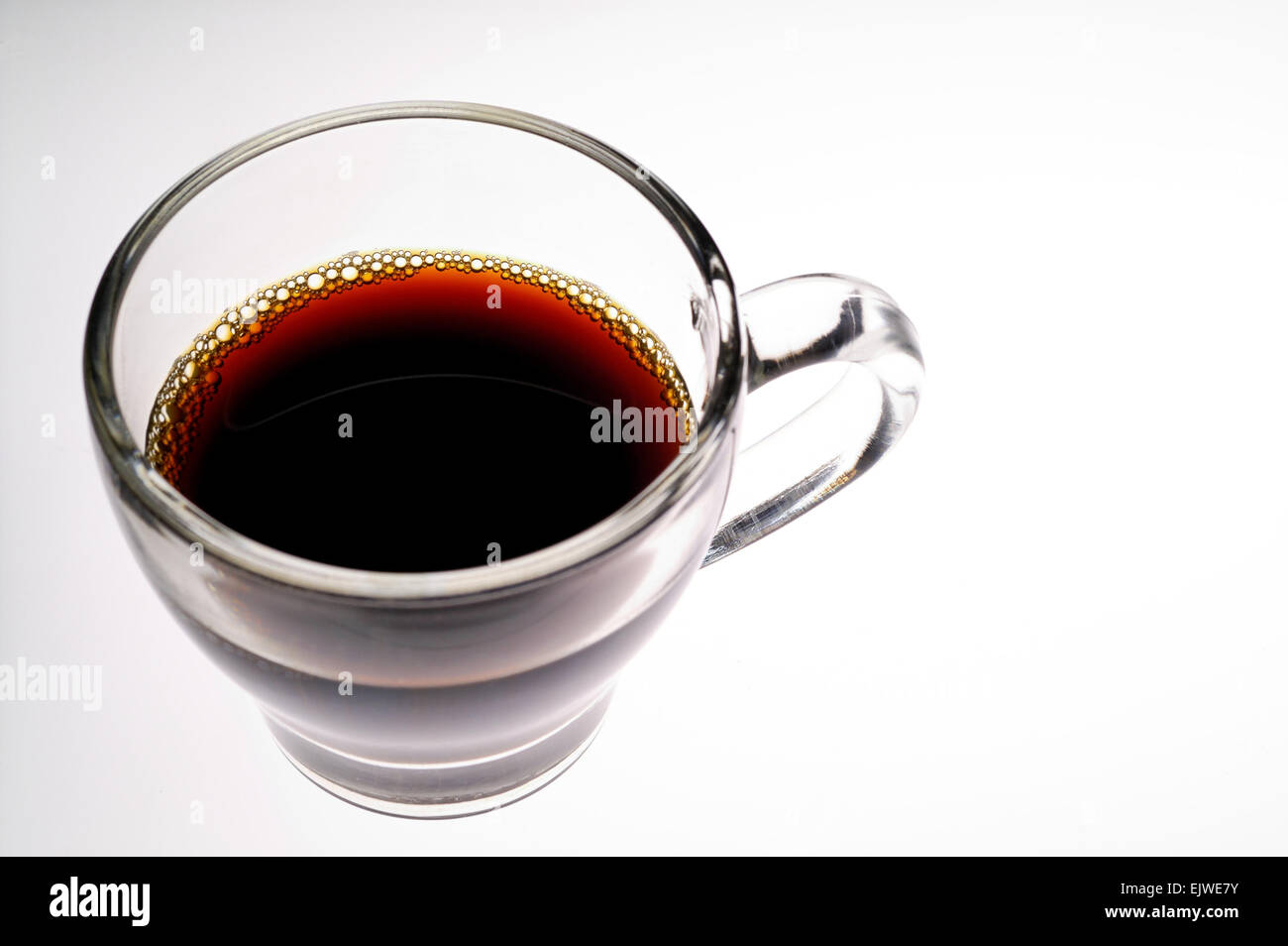 Coffee in glass cup on white background top view Stock Photo - Alamy