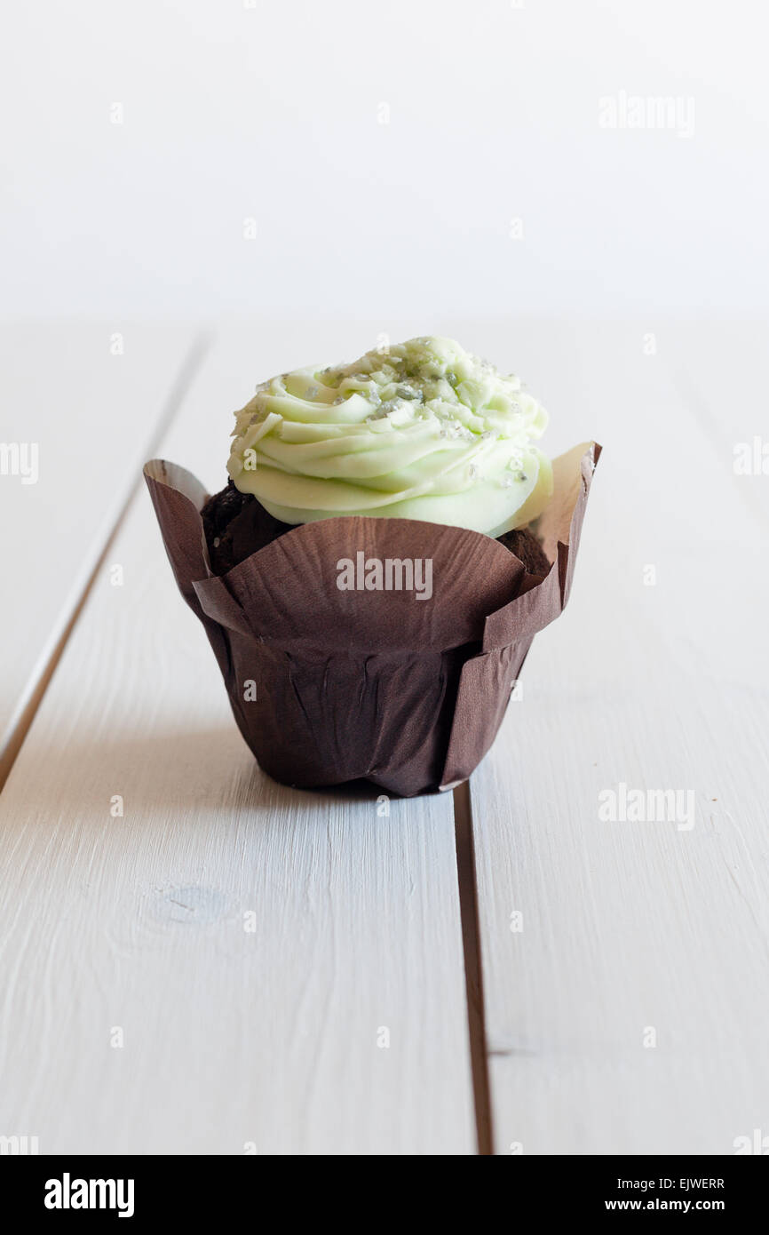 cupcake with green frosting Stock Photo - Alamy