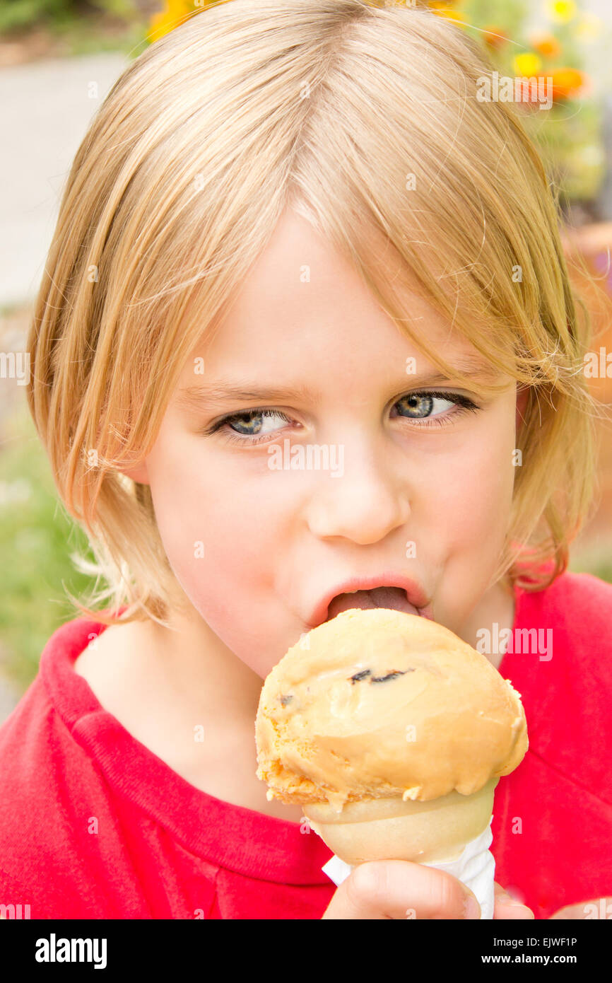 Pretty Little Girl Eating Ice Cream in the Park Stock Photo - Alamy