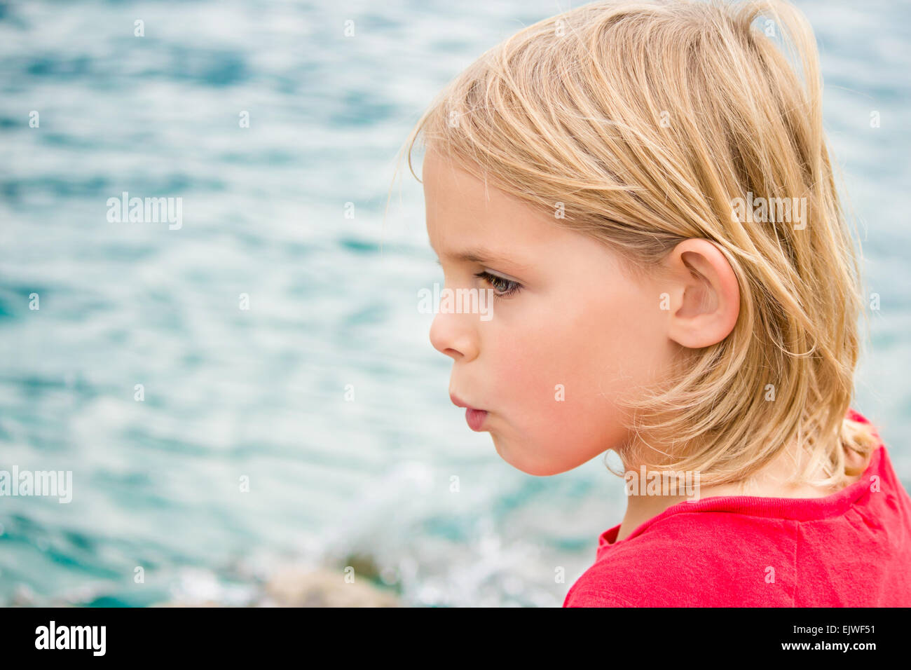 Coy kid hi-res stock photography and images - Alamy
