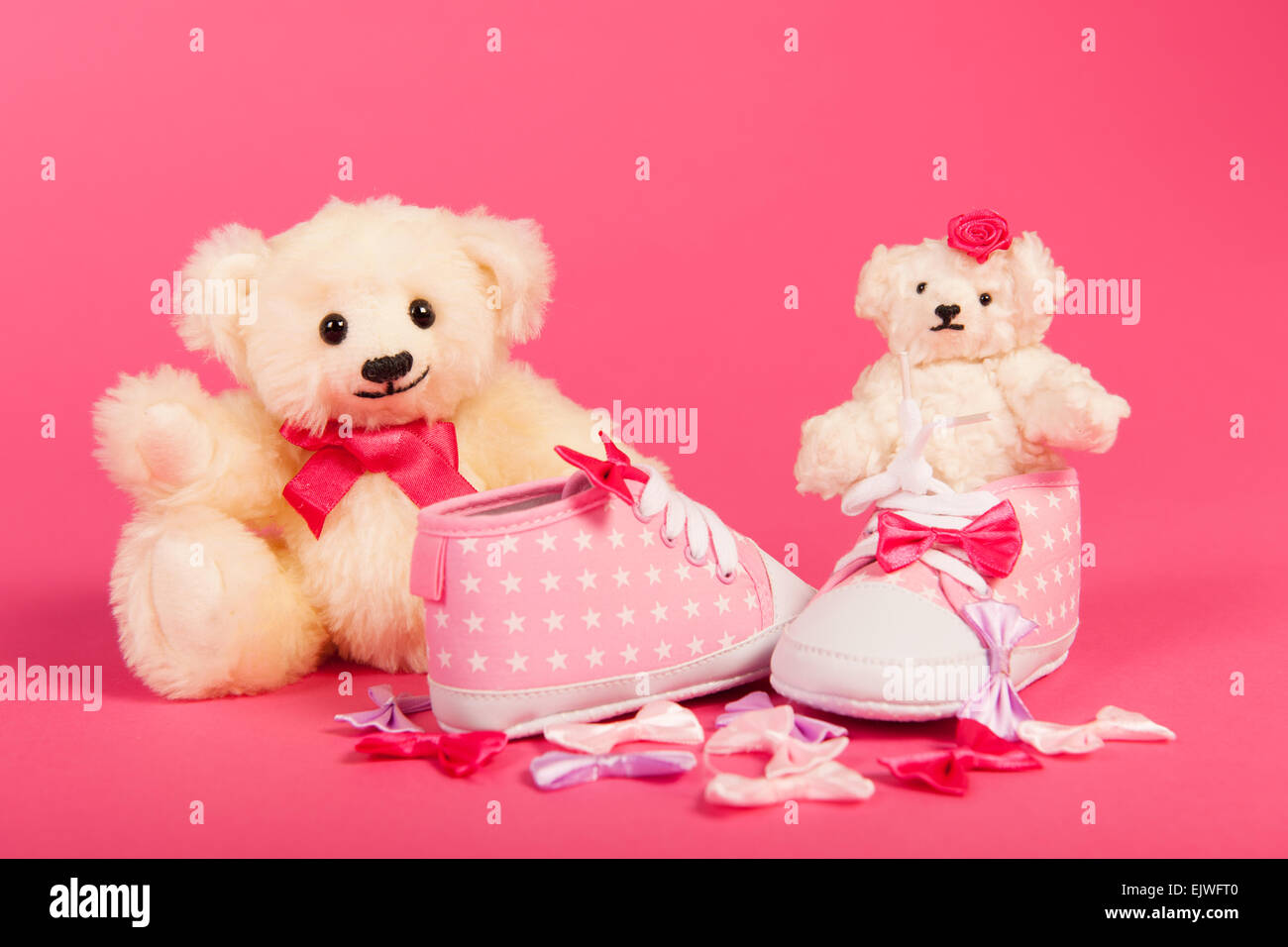 White hand made teddy bears and pink baby shoes Stock Photo - Alamy
