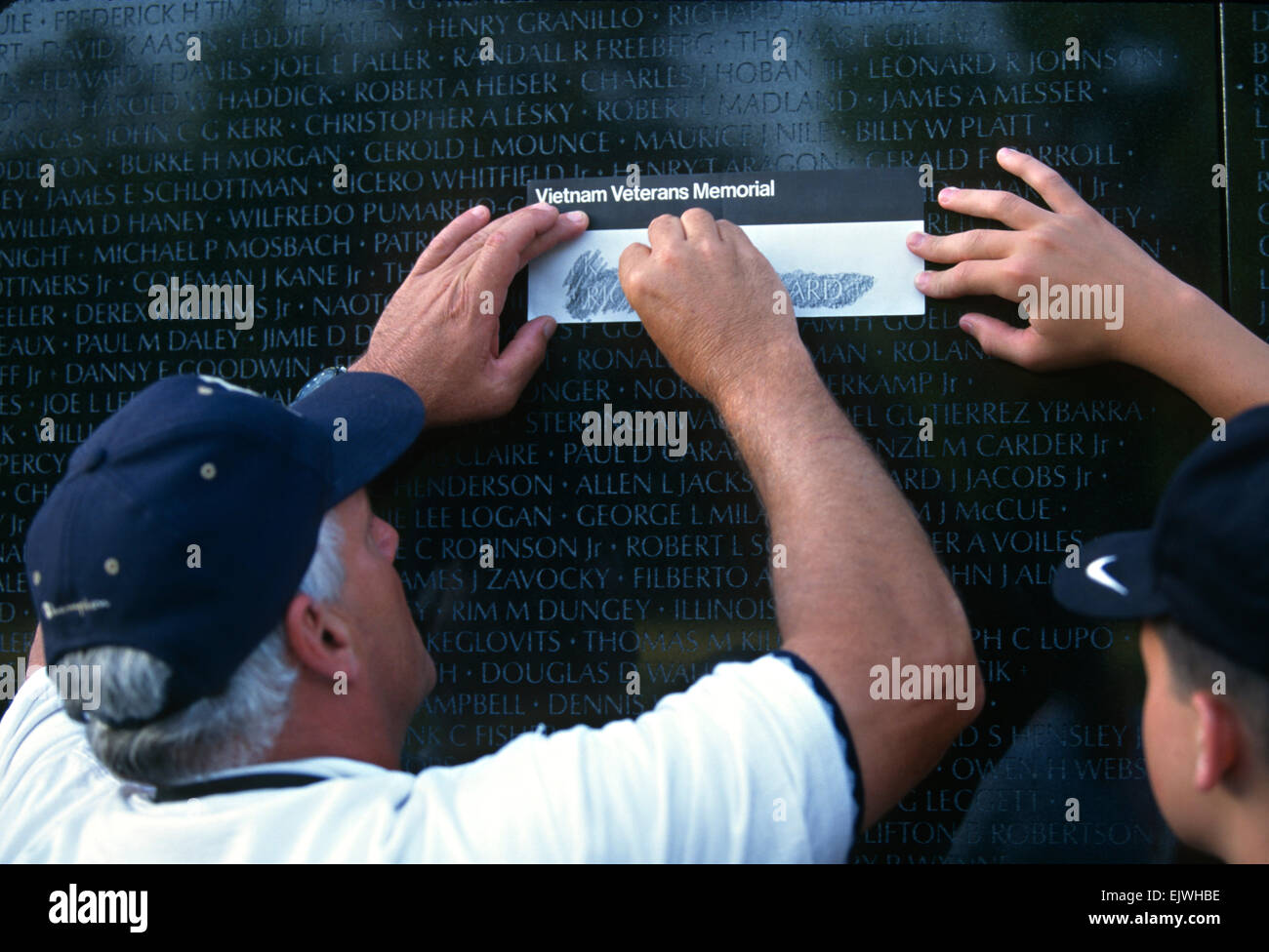 A traces a name from the Vietnam Veterans Memorial wall November 11 ...