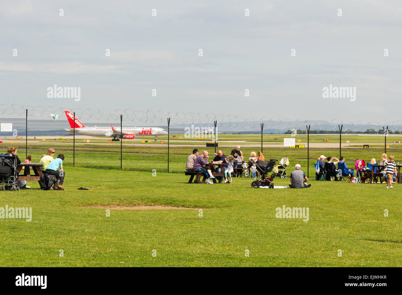 Families visiting Manchester airport's Runway Visitor park, watching ...