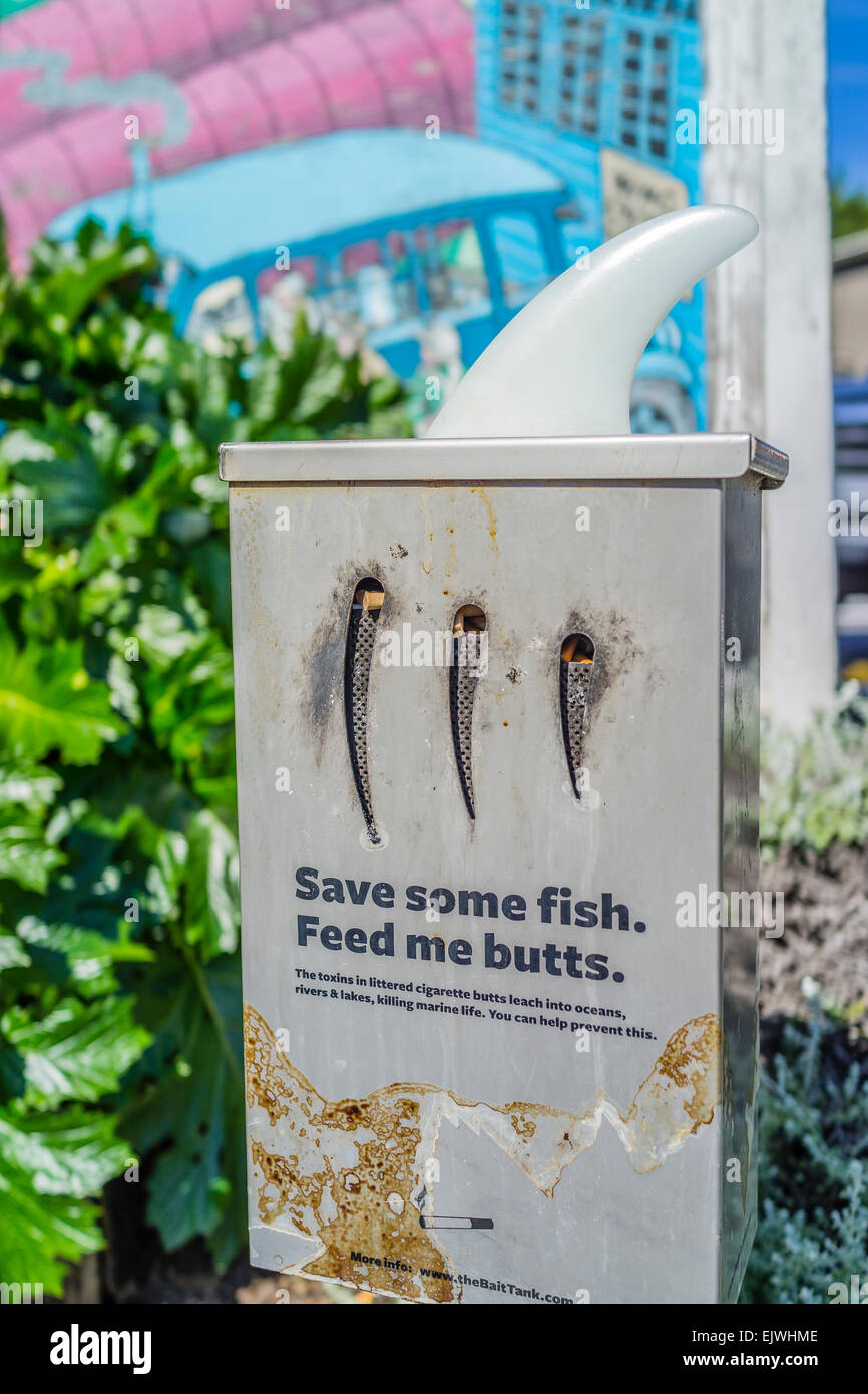 A sliver colored metal box topped by a black shark's fin on a pole on a ...