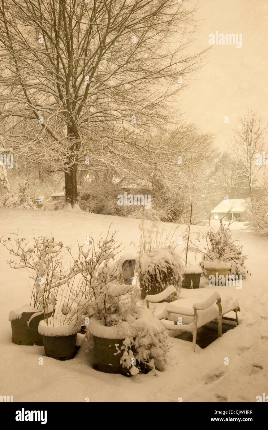 A backyard patio photographed at night during a heavy snow Stock Photo ...