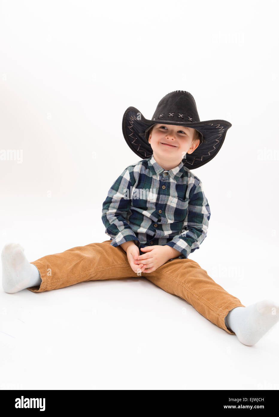 Little cowboy with black hat isolated Stock Photo - Alamy