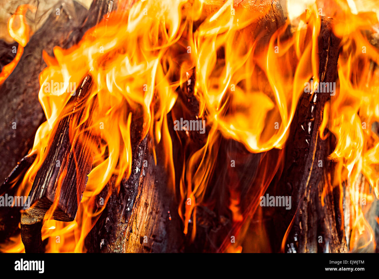 Burning woods into the fireplace, abstract backgrounds Stock Photo - Alamy