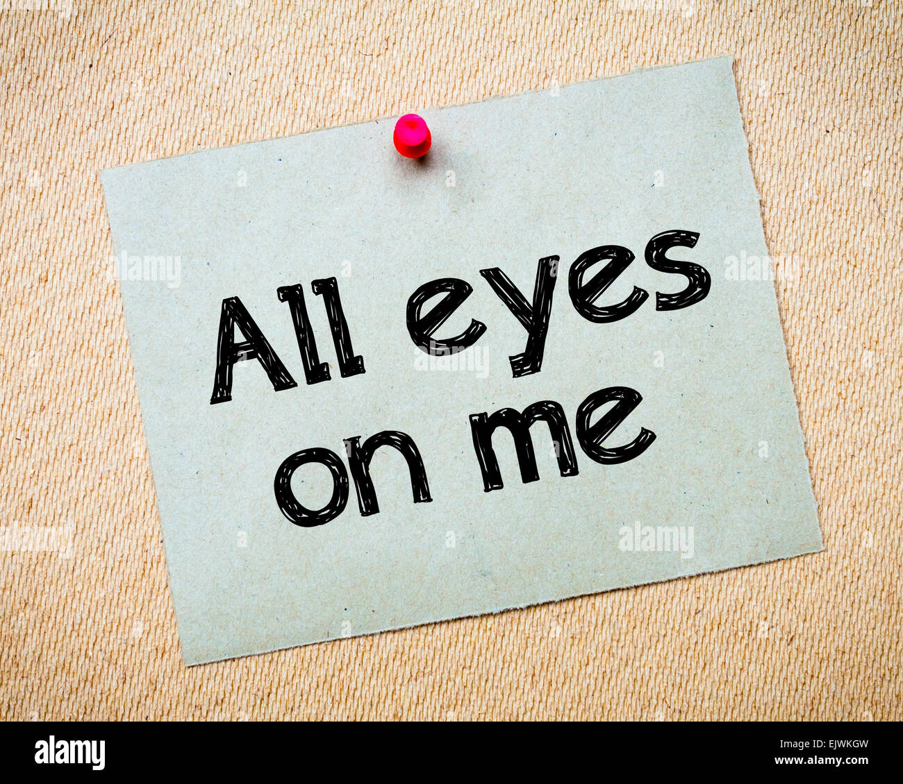 All eyes on me Message. Recycled paper note pinned on cork board ...
