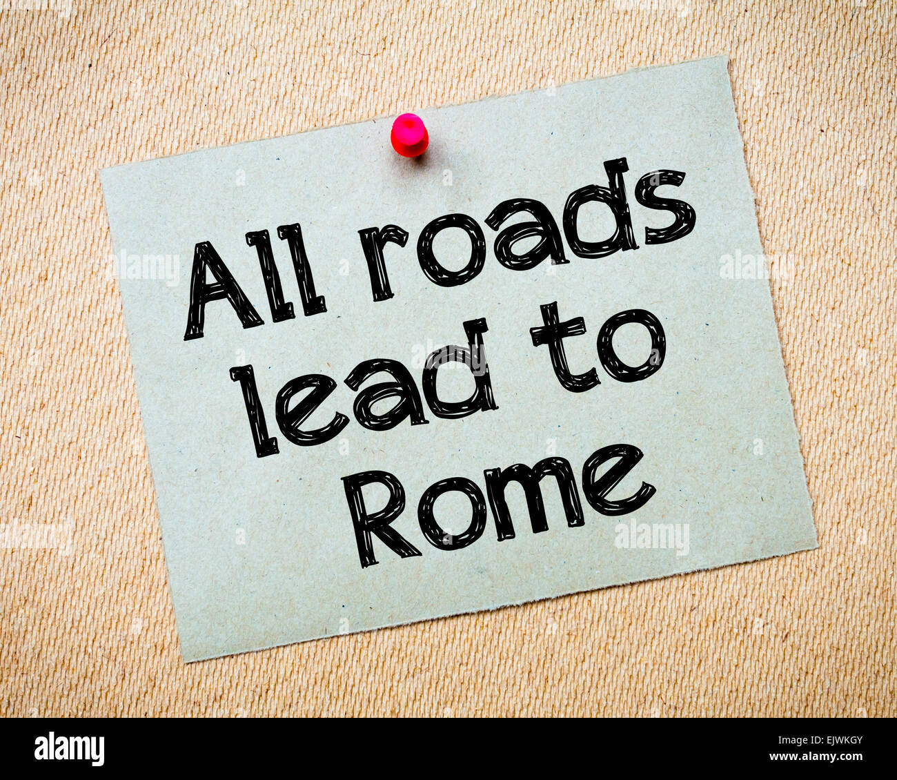 All roads lead to Rome Message. Recycled paper note pinned on cork ...