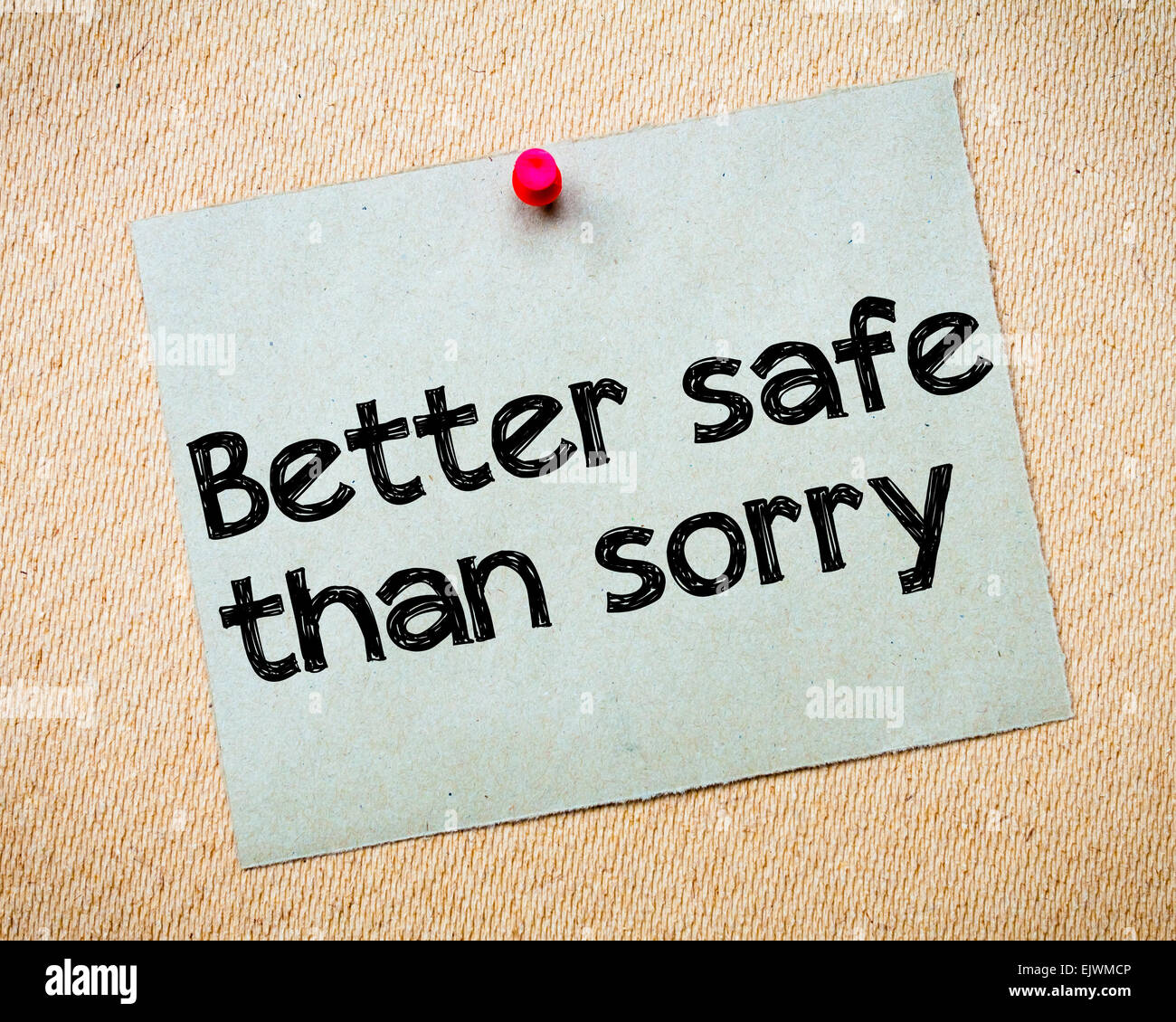 Better safe than sorry Message. Recycled paper note pinned on cork ...