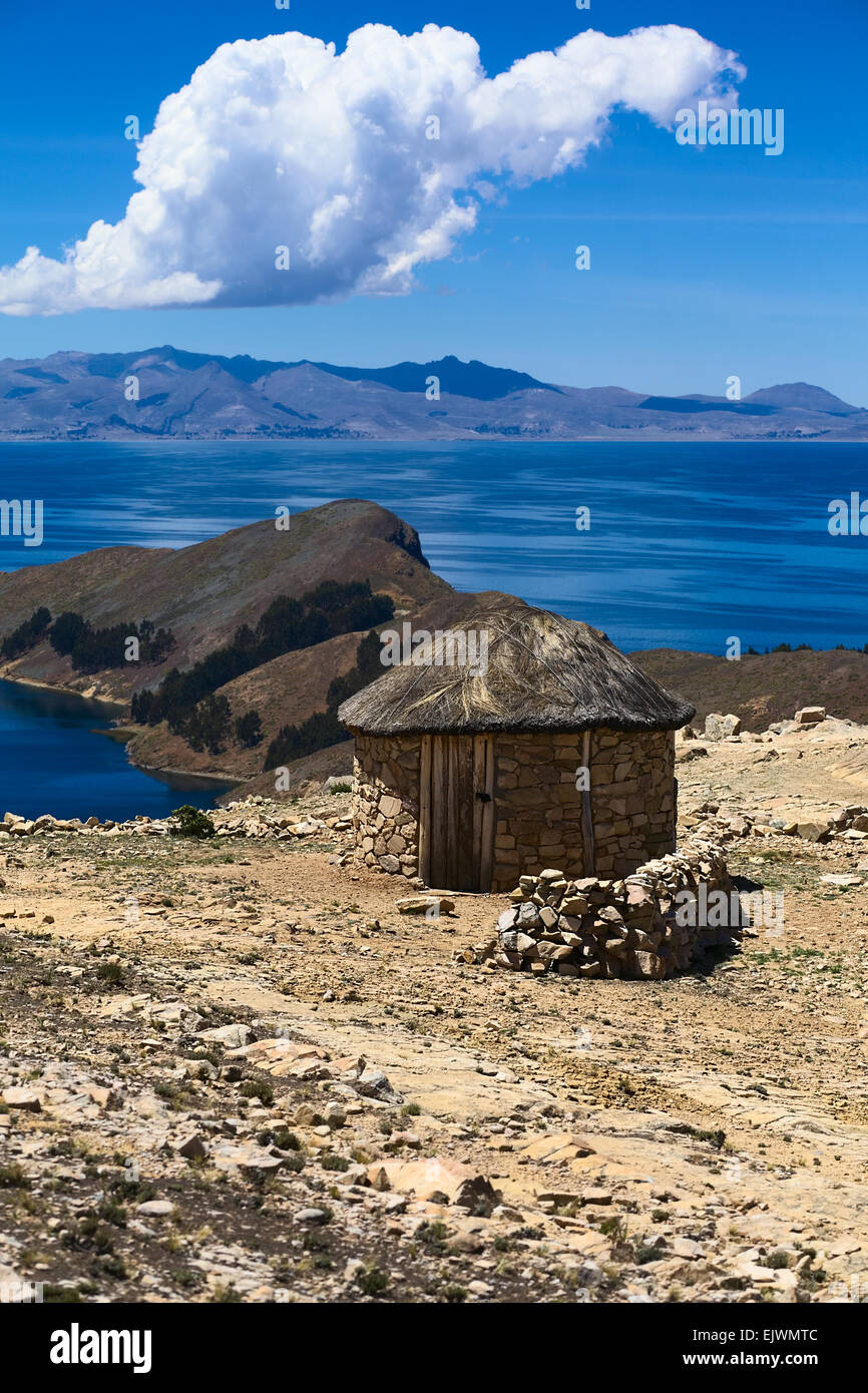 Small stone hut with thatched roof on Isla del Sol (Island of the Sun ...