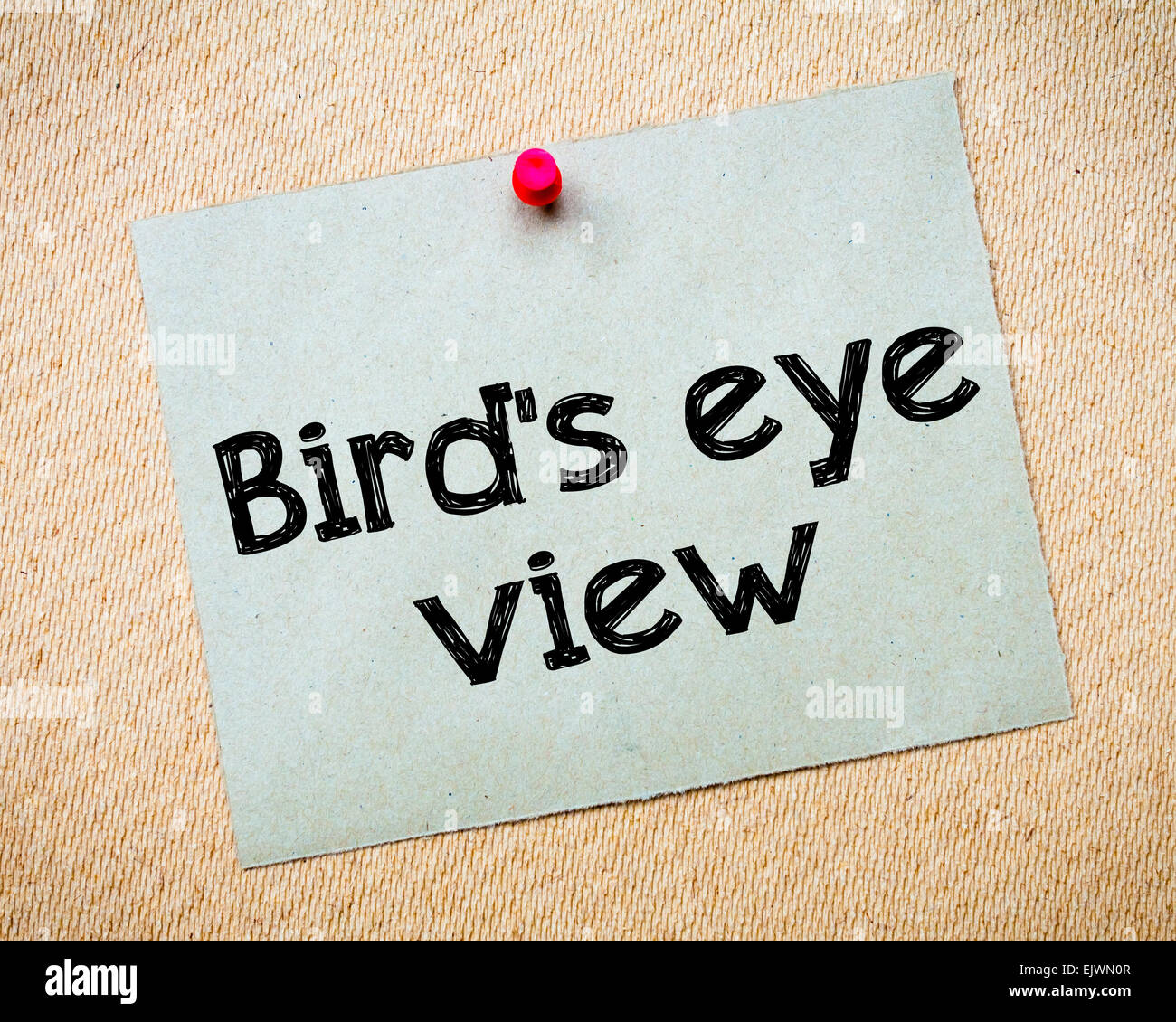 Bird's eye view Message. Recycled paper note pinned on cork board ...
