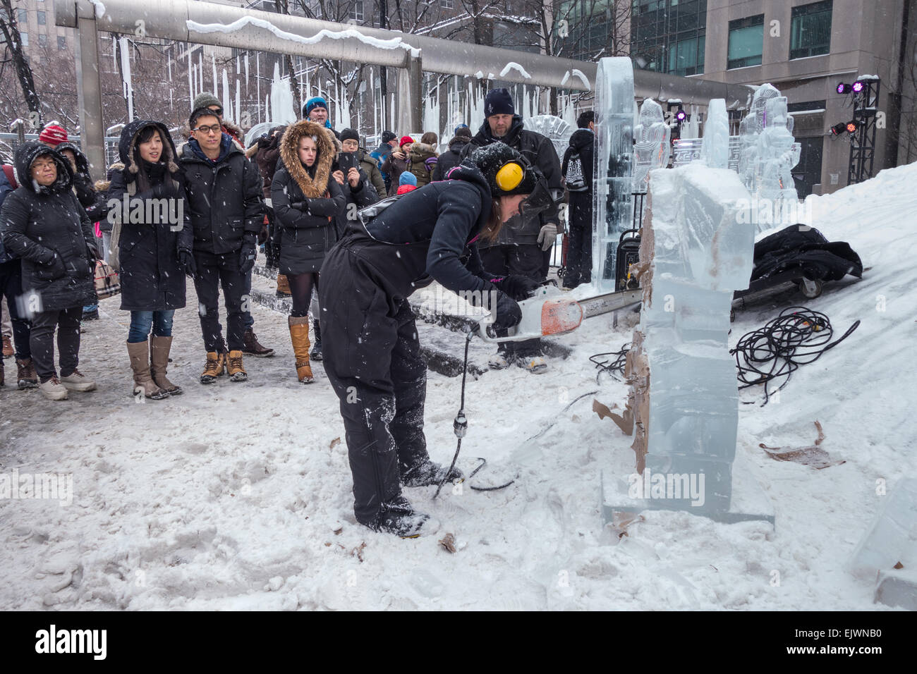 female artist using chainsaw to make ice sculpture Stock Photo - Alamy
