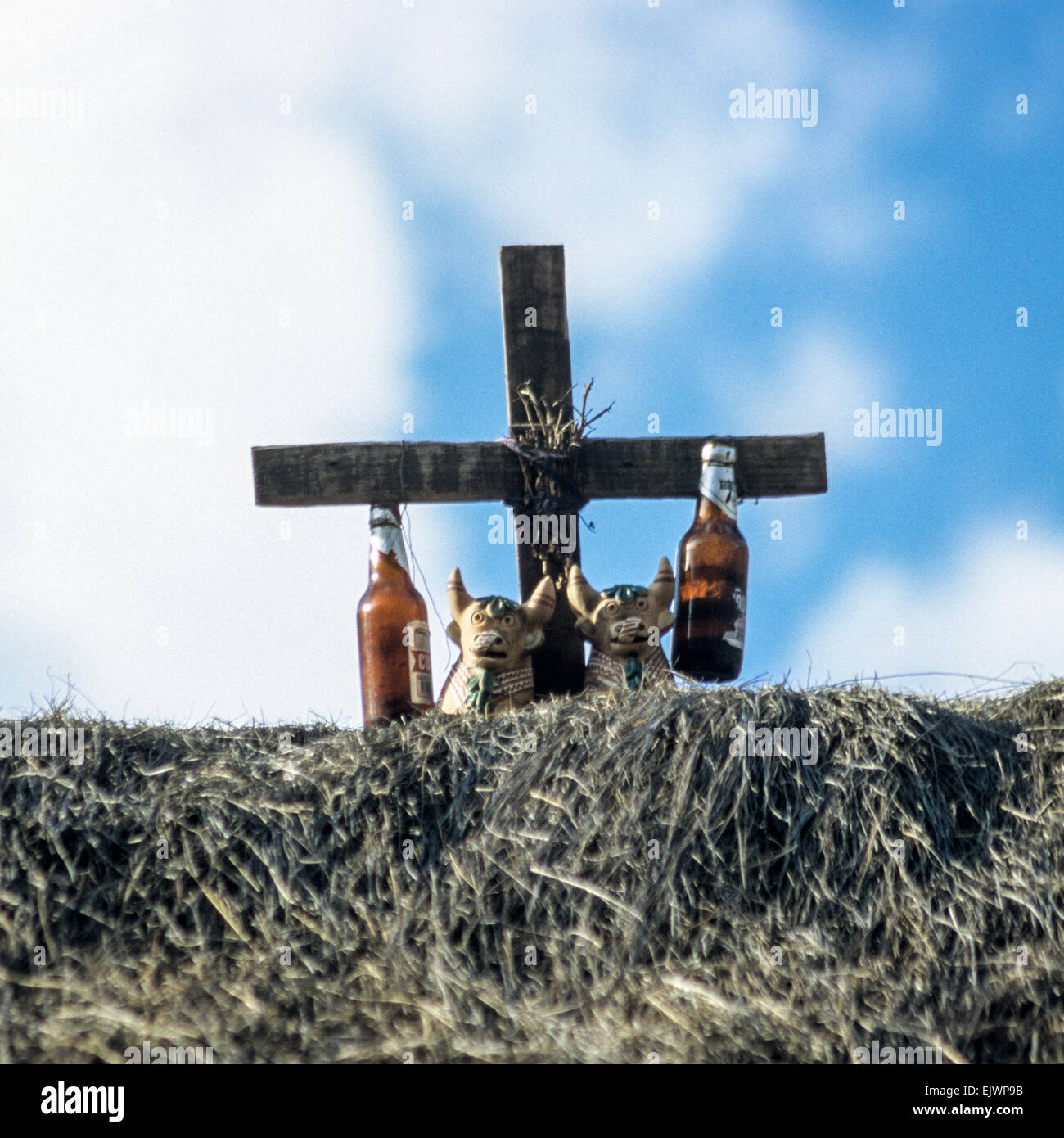 Peru, Ollantaytambo. Religious Syncretism. Cross and Bulls on Rooftop ...
