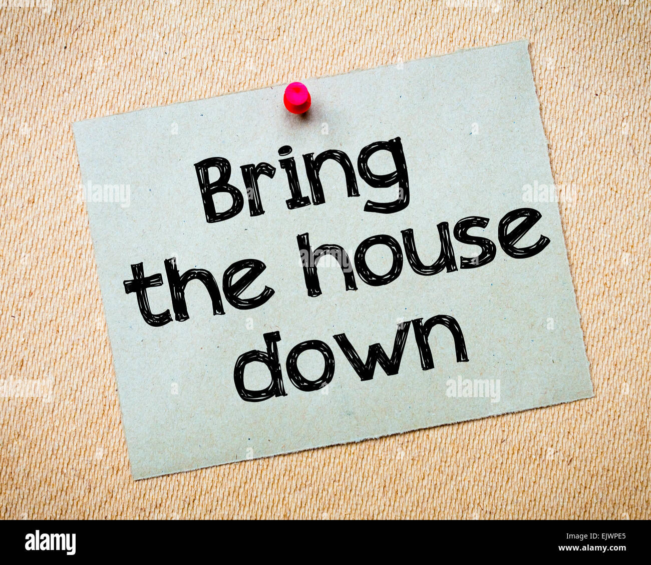 Bring the house down Message. Recycled paper note pinned on cork board ...