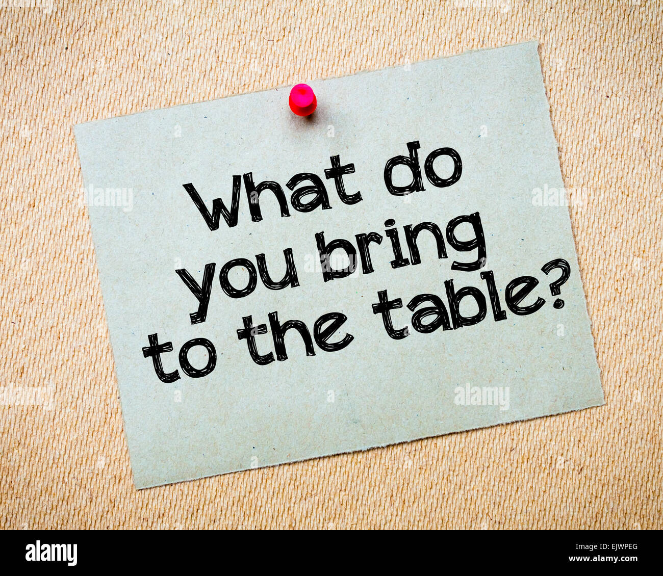 What do you bring to the table? Message. Recycled paper note pinned on ...