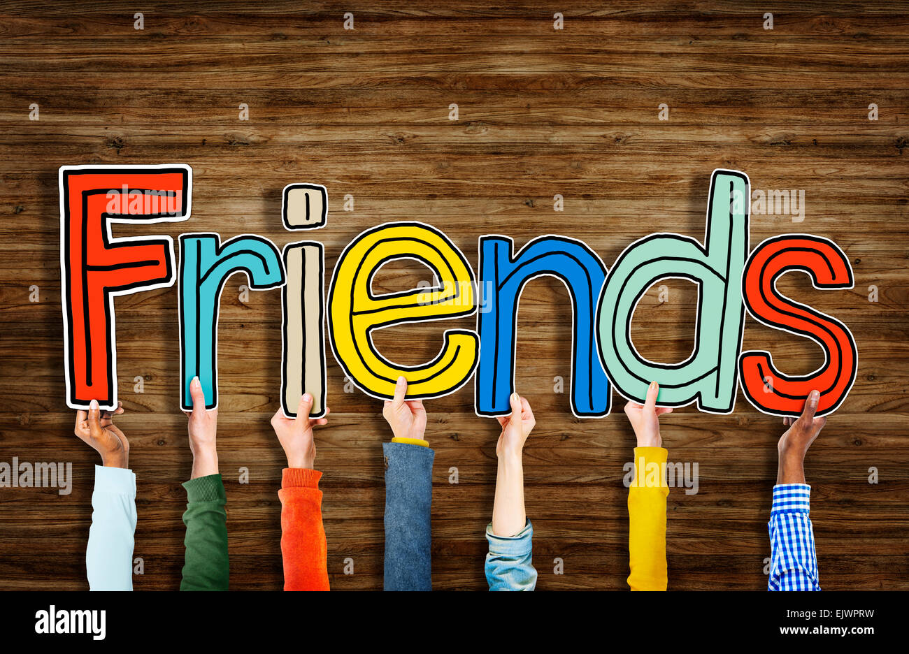 Multiethnic Group of Hands Holding Letter Friends Stock Photo - Alamy