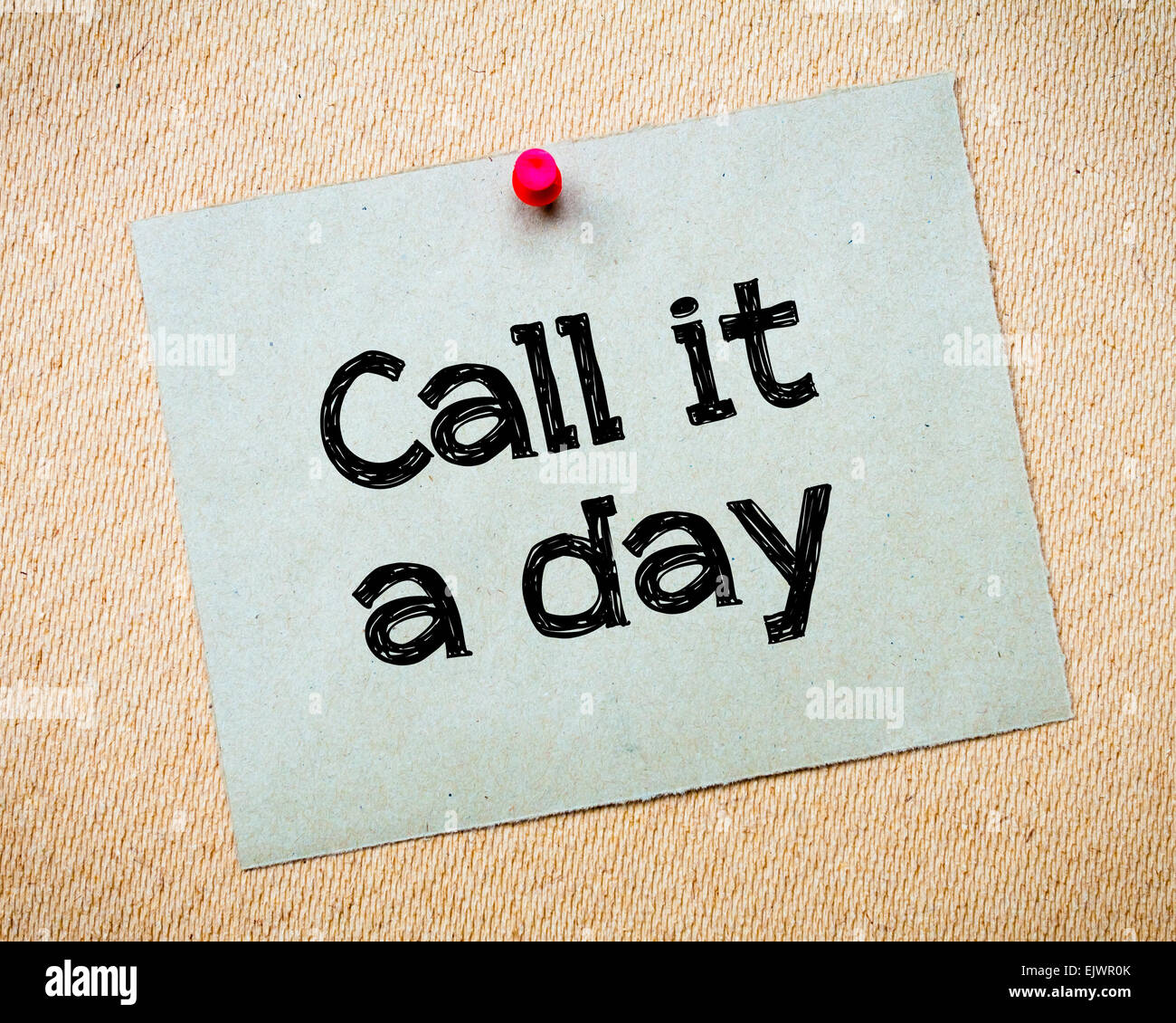 Call it a day Message. Recycled paper note pinned on cork board ...