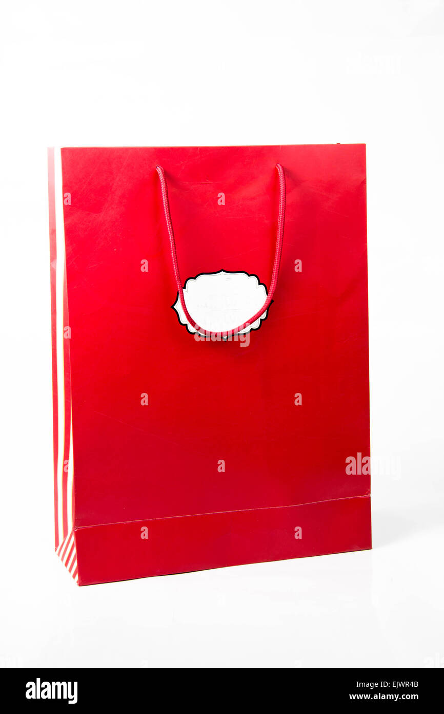 A red color paper bags isolated on white Stock Photo - Alamy