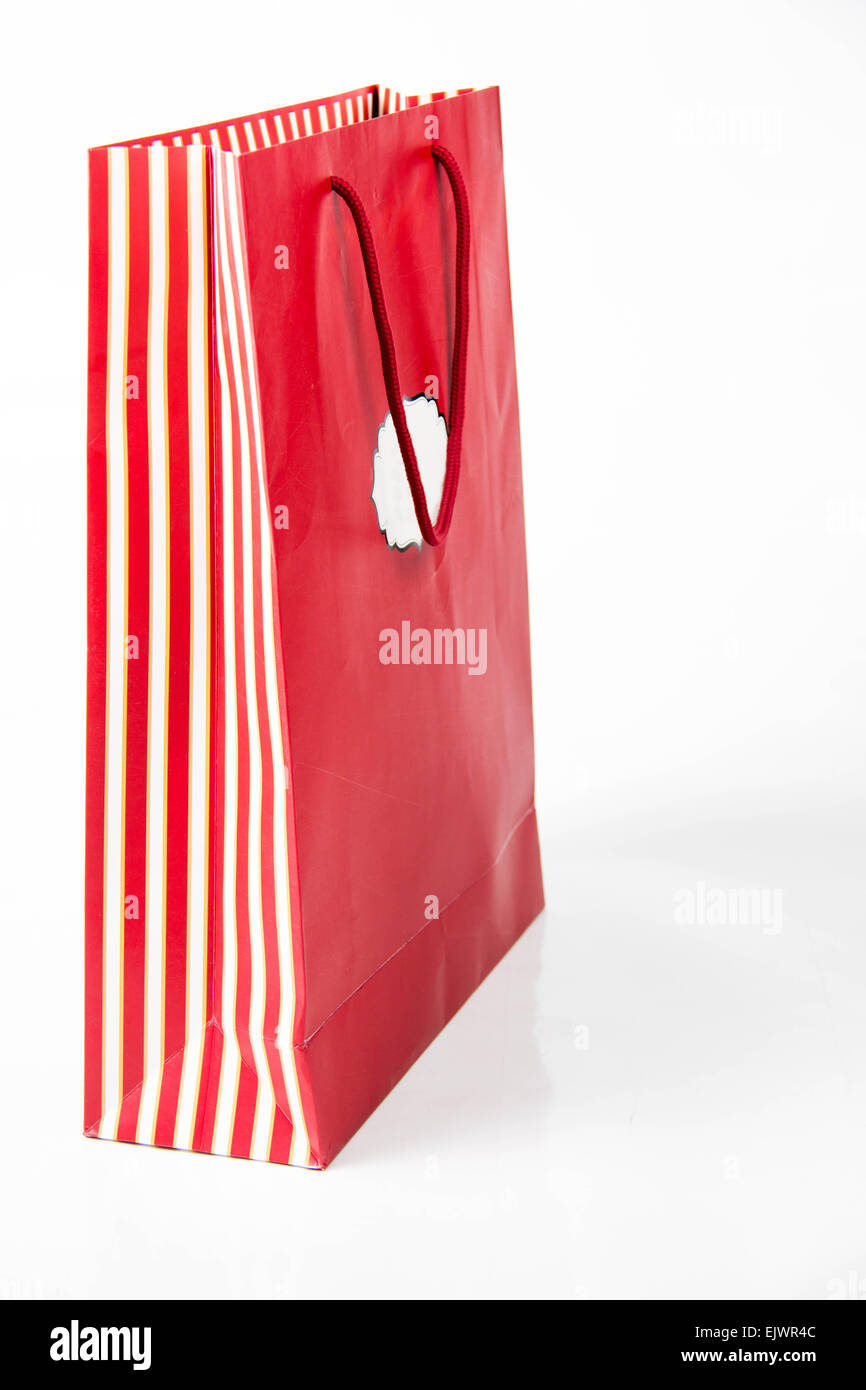 A red color paper bags isolated on white Stock Photo - Alamy
