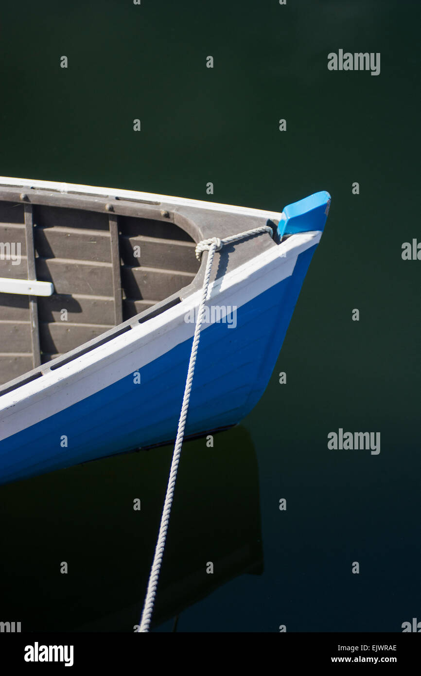 Wooden row boats tied to the dock Stock Photo - Alamy