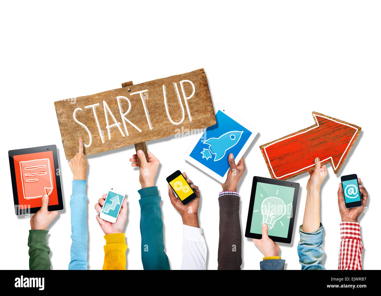 Hands Holding Devices and Start Up Symbols Stock Photo - Alamy