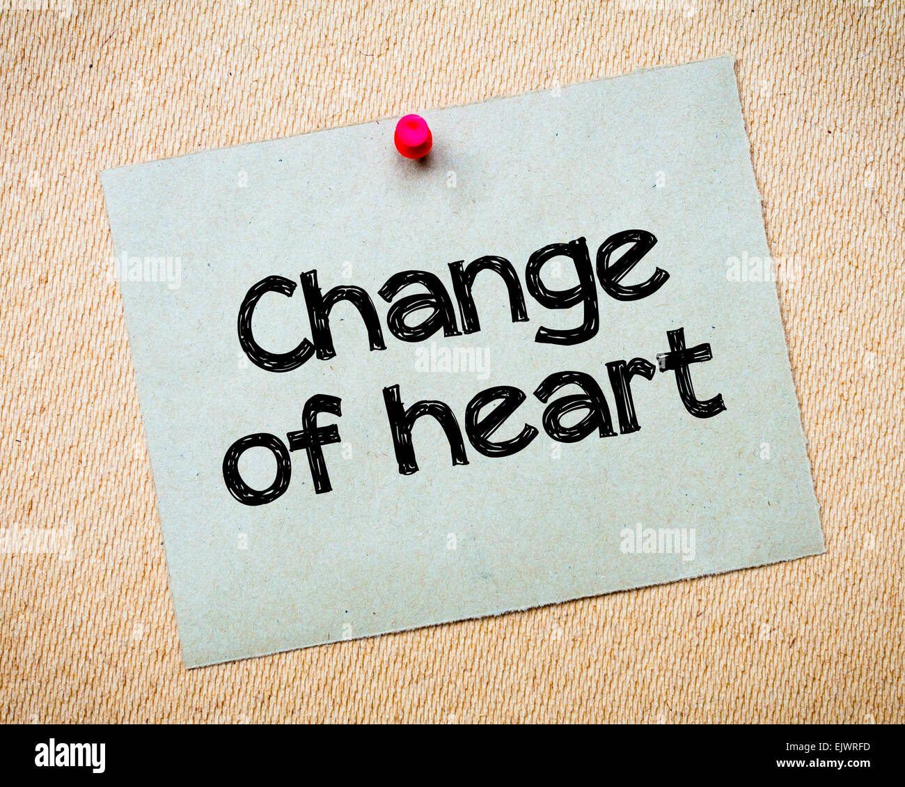 Change of heart Message. Recycled paper note pinned on cork board ...