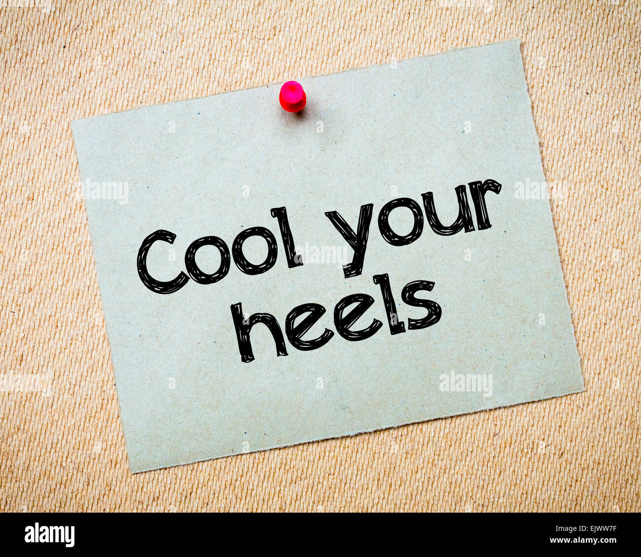 Cool your heels Message. Recycled paper note pinned on cork board ...