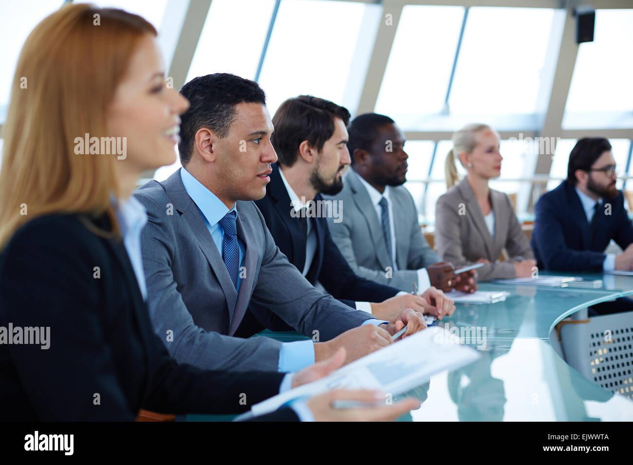Row of serious business people attending seminar Stock Photo - Alamy