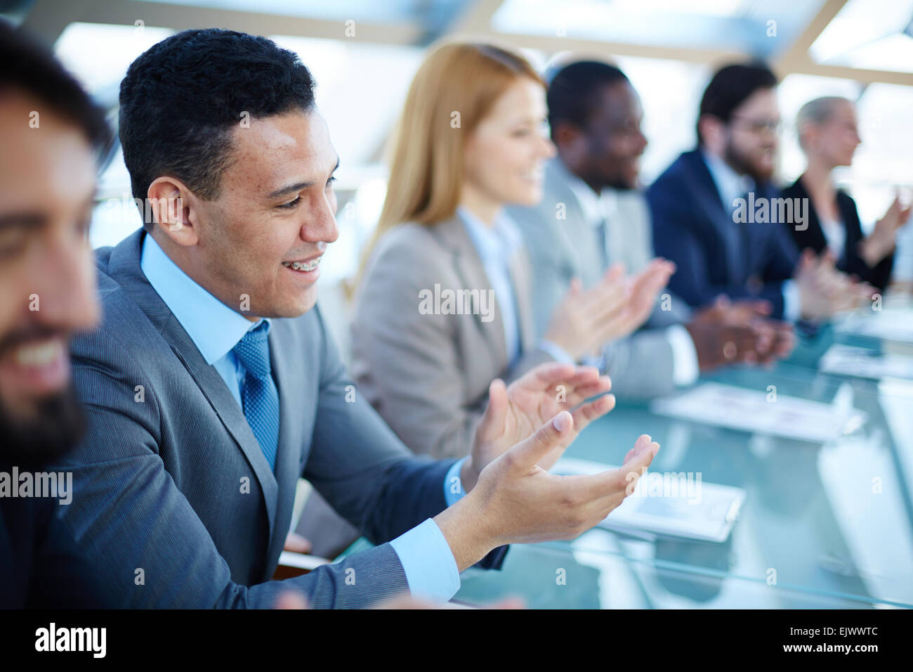 Happy business people applauding to speaker at seminar Stock Photo - Alamy Happy business people applauding to speaker at seminar Stock Photo - Alamy