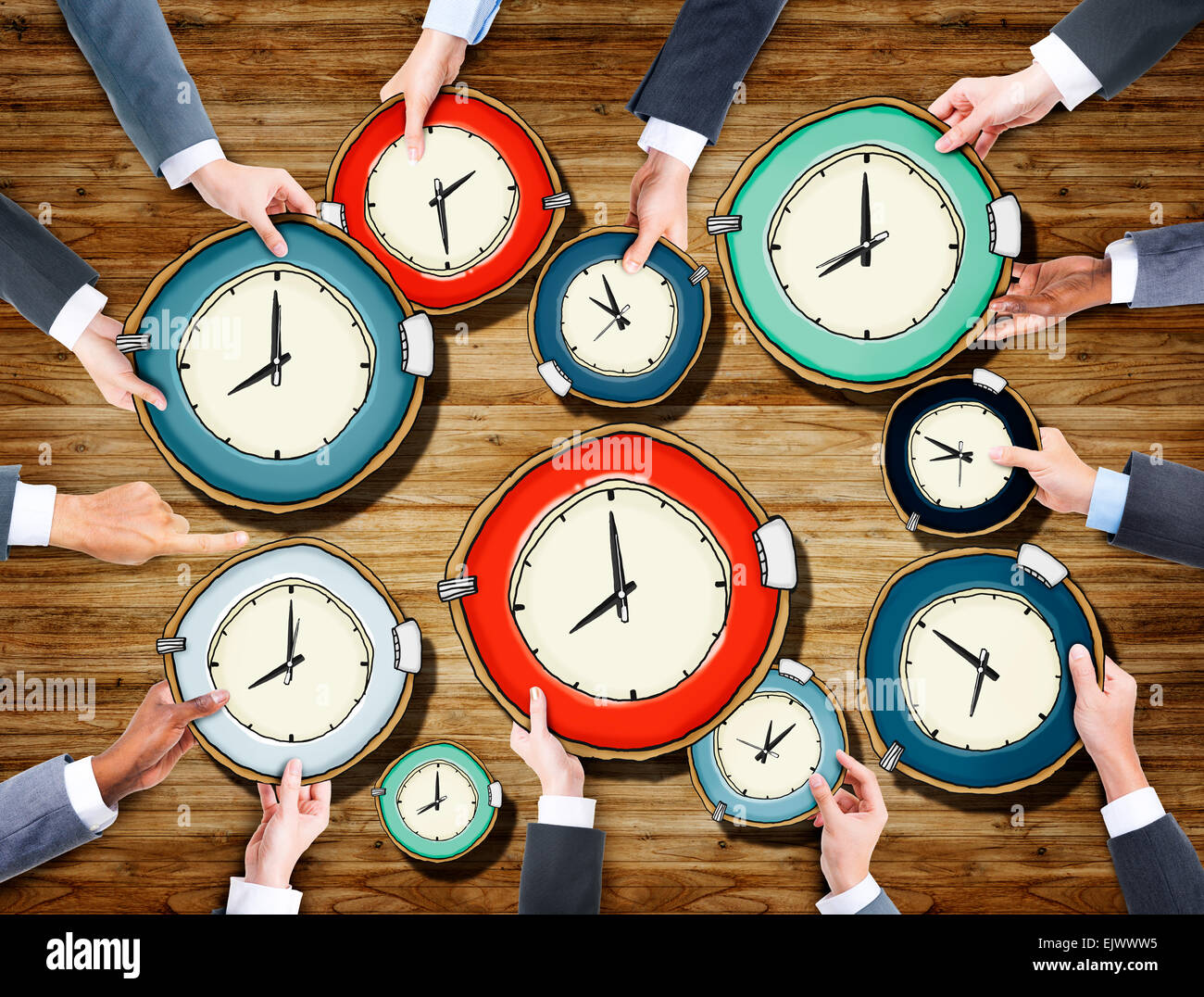 Group of Business People's Hands Holding Clocks Stock Photo - Alamy