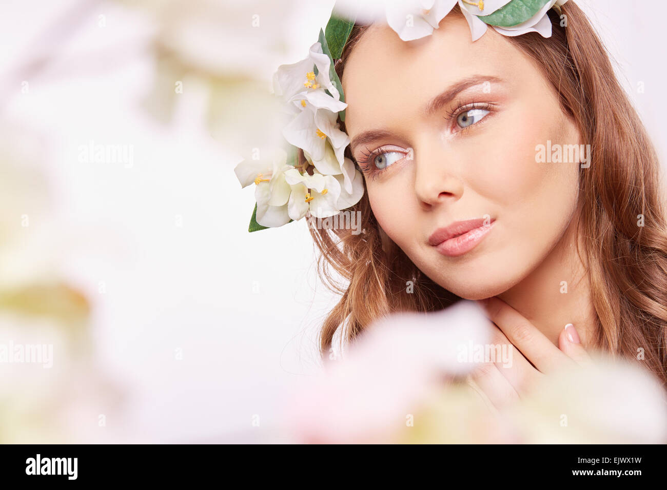 Fragile girl with natural makeup looking sideway Stock Photo - Alamy