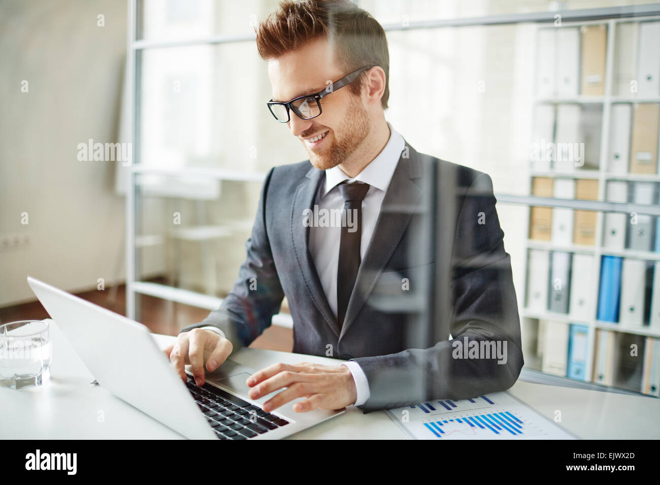 Happy businessman networking in office Stock Photo - Alamy
