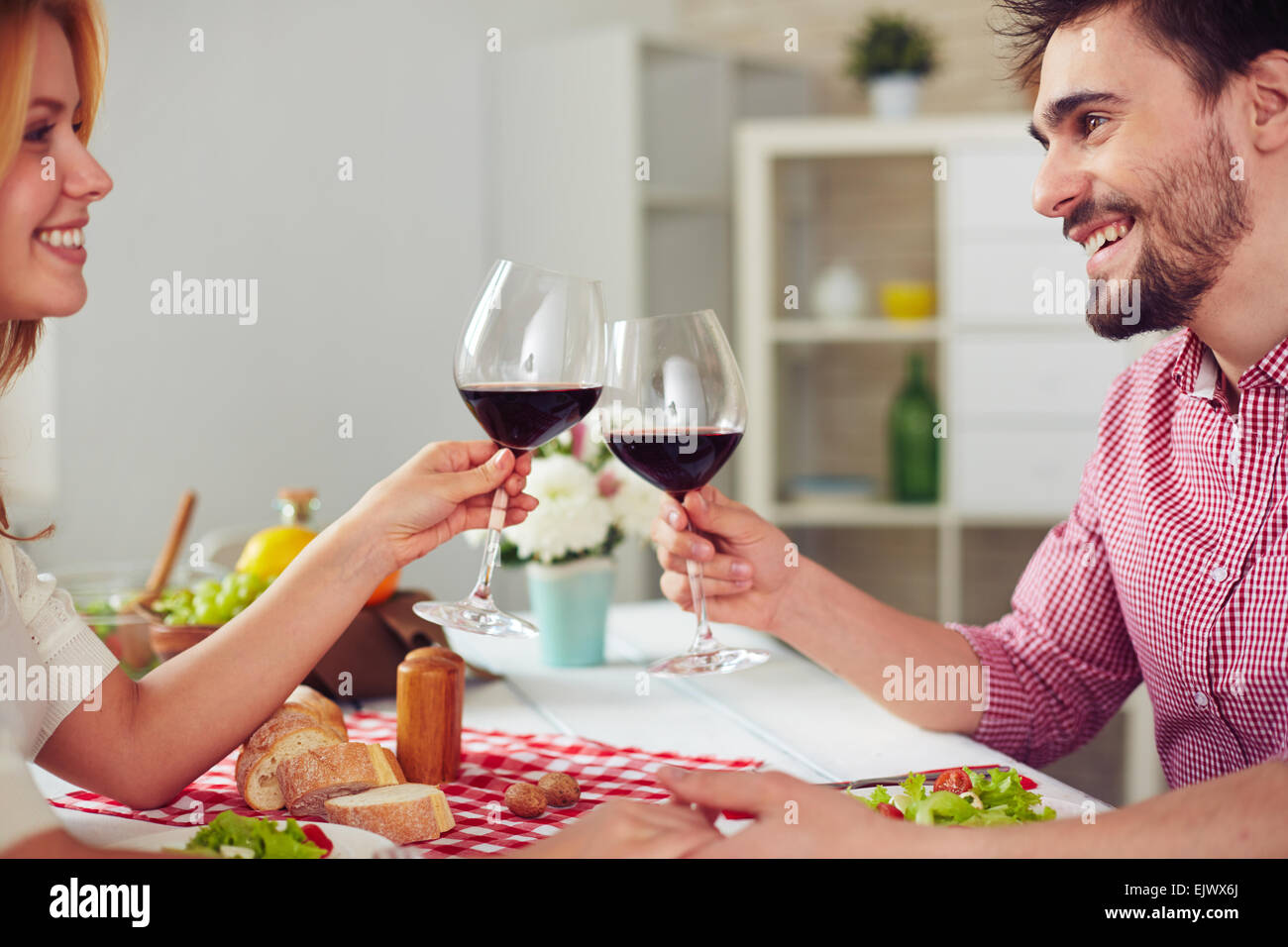 Happy couple cheering glass hi-res stock photography and images - Alamy