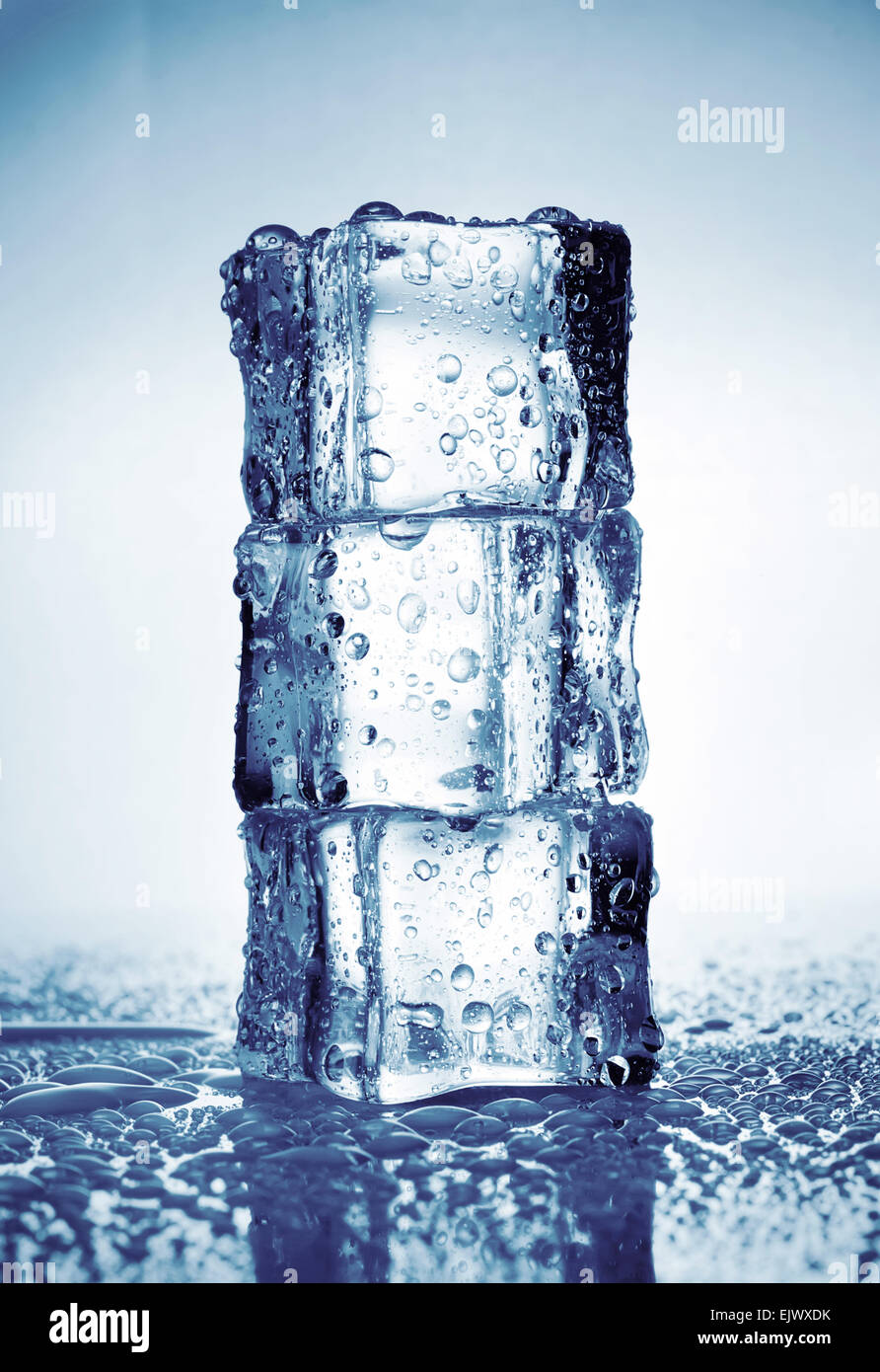 Pyramid of three ice cubes on a gradient Stock Photo - Alamy