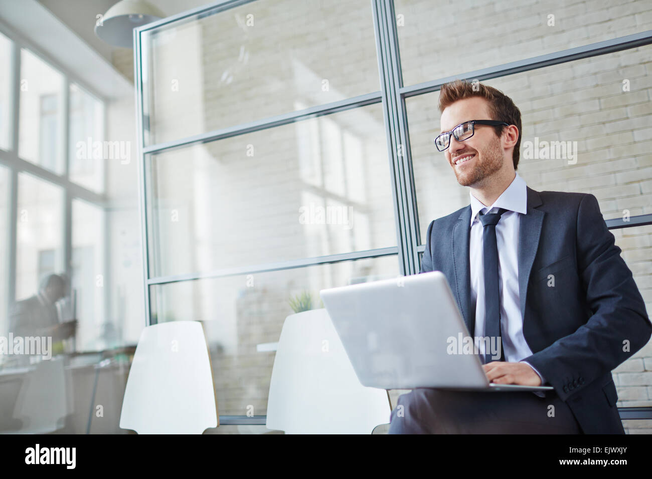 Happy businessman networking in office Stock Photo - Alamy