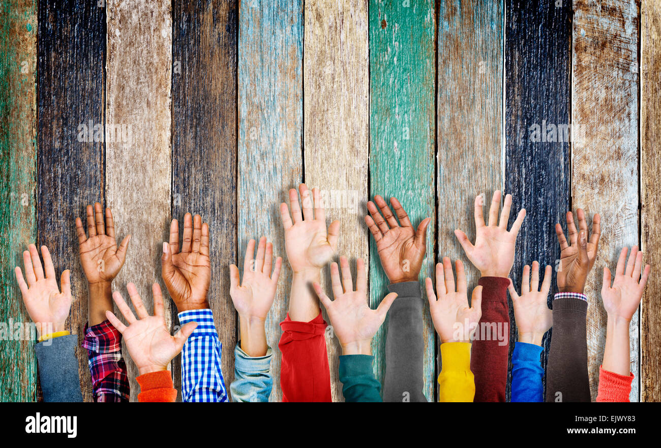 Group of Diverse Hands Raised Stock Photo - Alamy