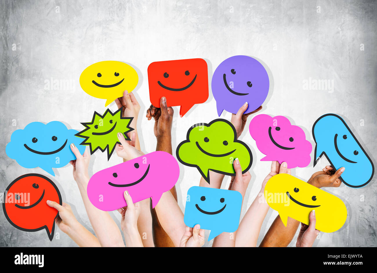 Hands holding smiley faces icons Stock Photo - Alamy