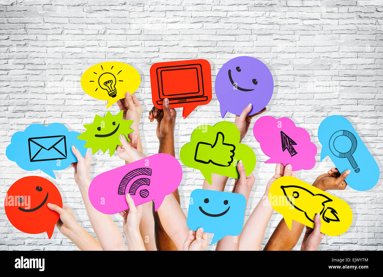 Hands holding computer icons Stock Photo - Alamy