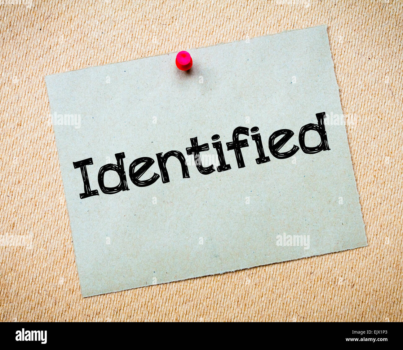 Identified Message. Recycled paper note pinned on cork board. Concept ...