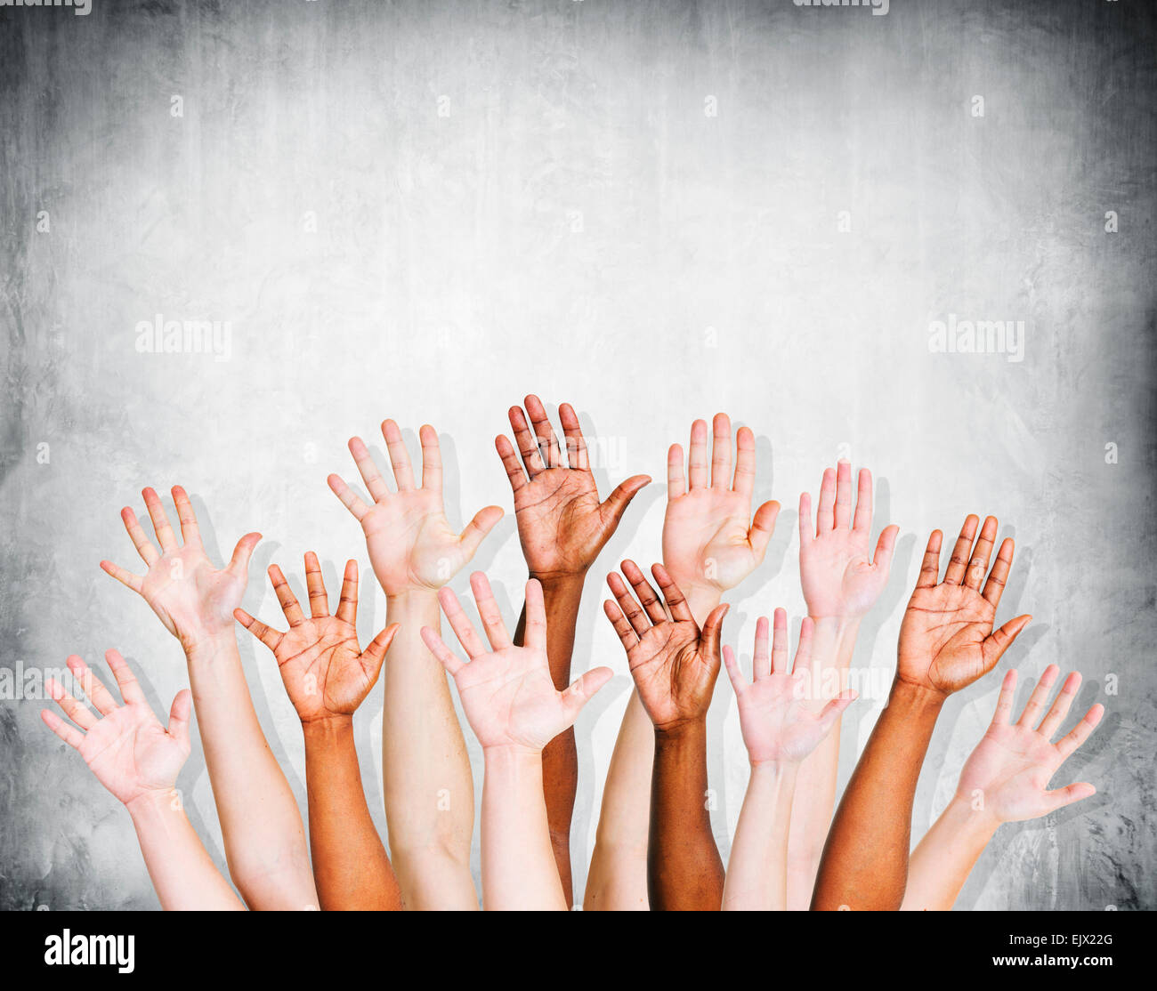 Group of human arms raised with concrete wall Stock Photo - Alamy