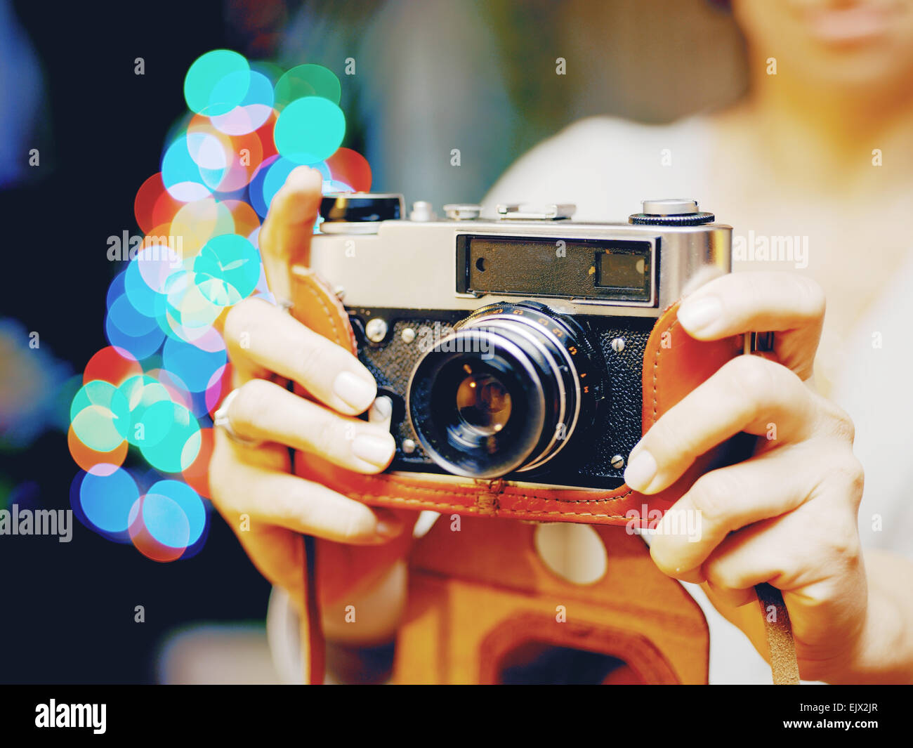 Smiling woman photographed retro camera. Vintage image processing Stock ...